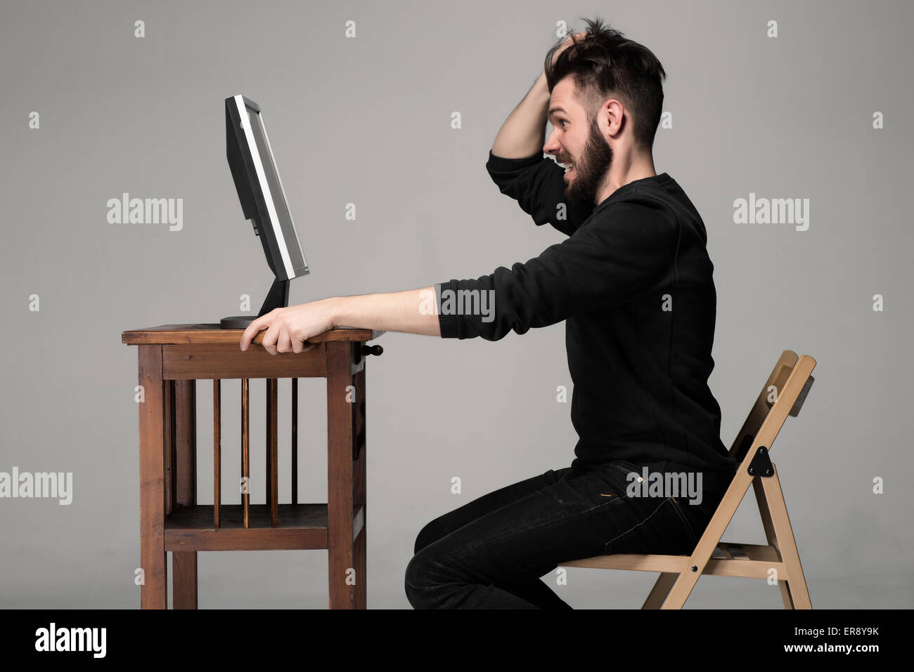 Funny and crazy man using a computer Stock Photo - Alamy