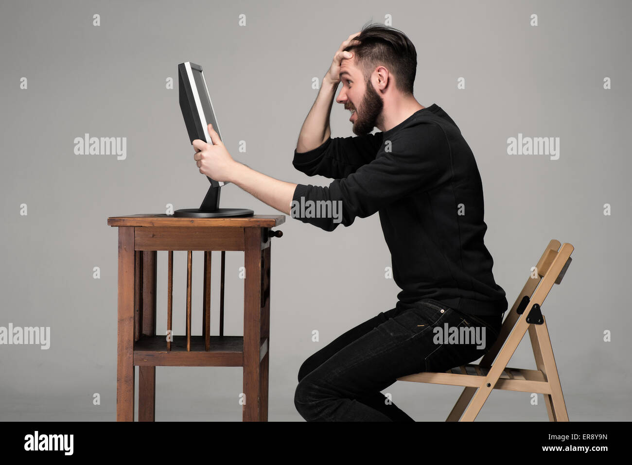 Funny and crazy man using a computer Stock Photo - Alamy