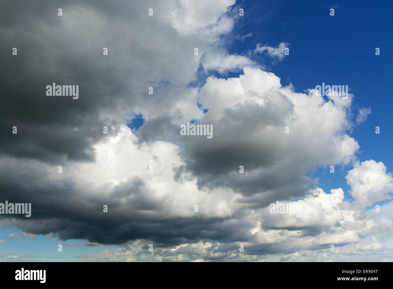 Storm Clouds forming a curve across a blue sky. Very low cloud with ...