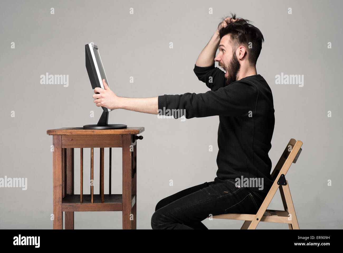 Funny and crazy man using a computer Stock Photo - Alamy