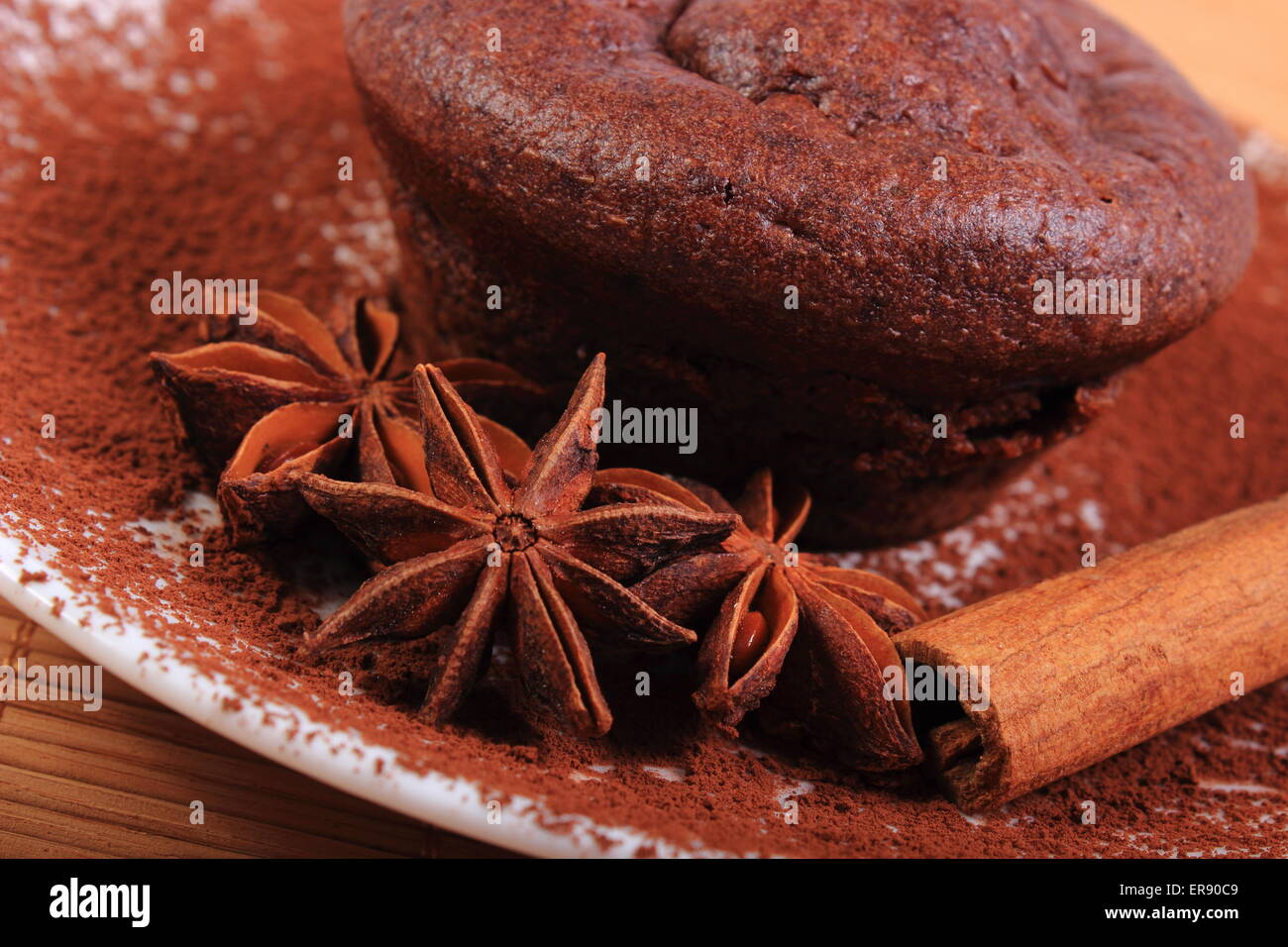 Homemade delicious fresh baked chocolate muffins with cocoa, star anise ...