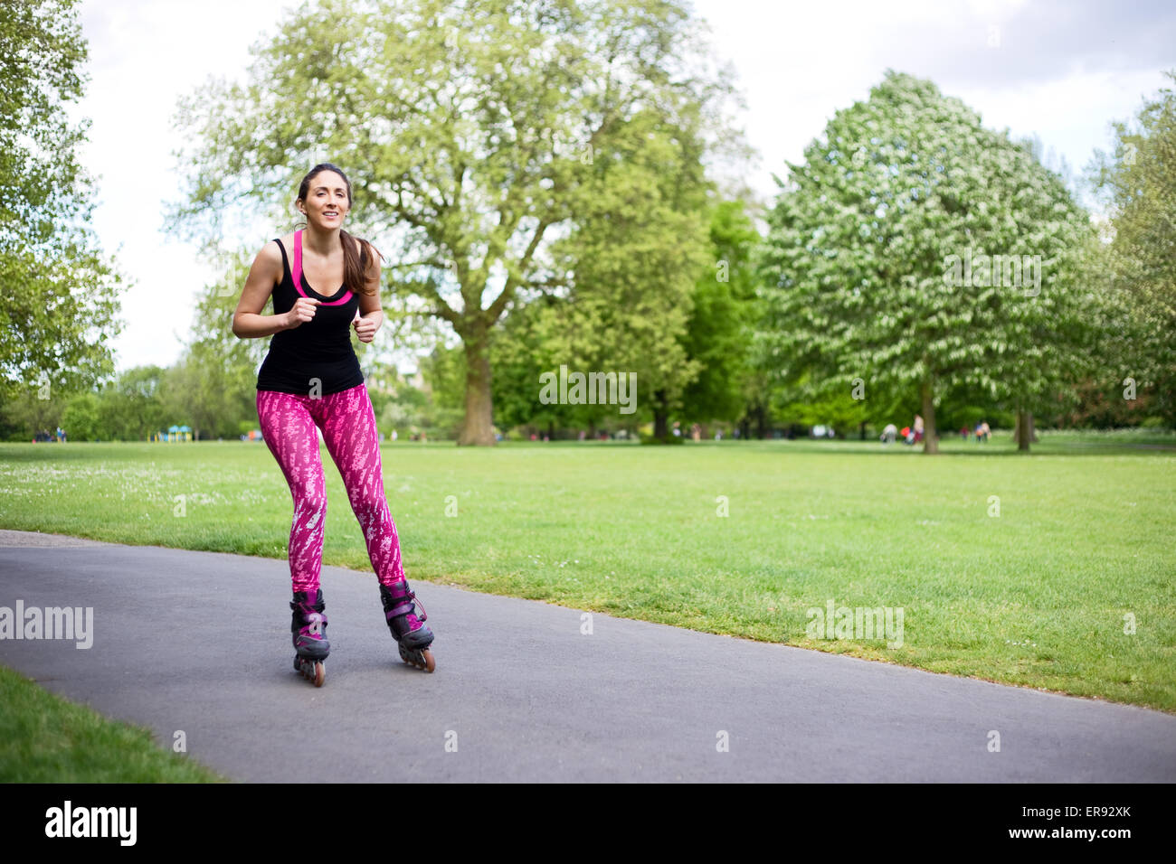 young woman skating in the park Stock Photo - Alamy