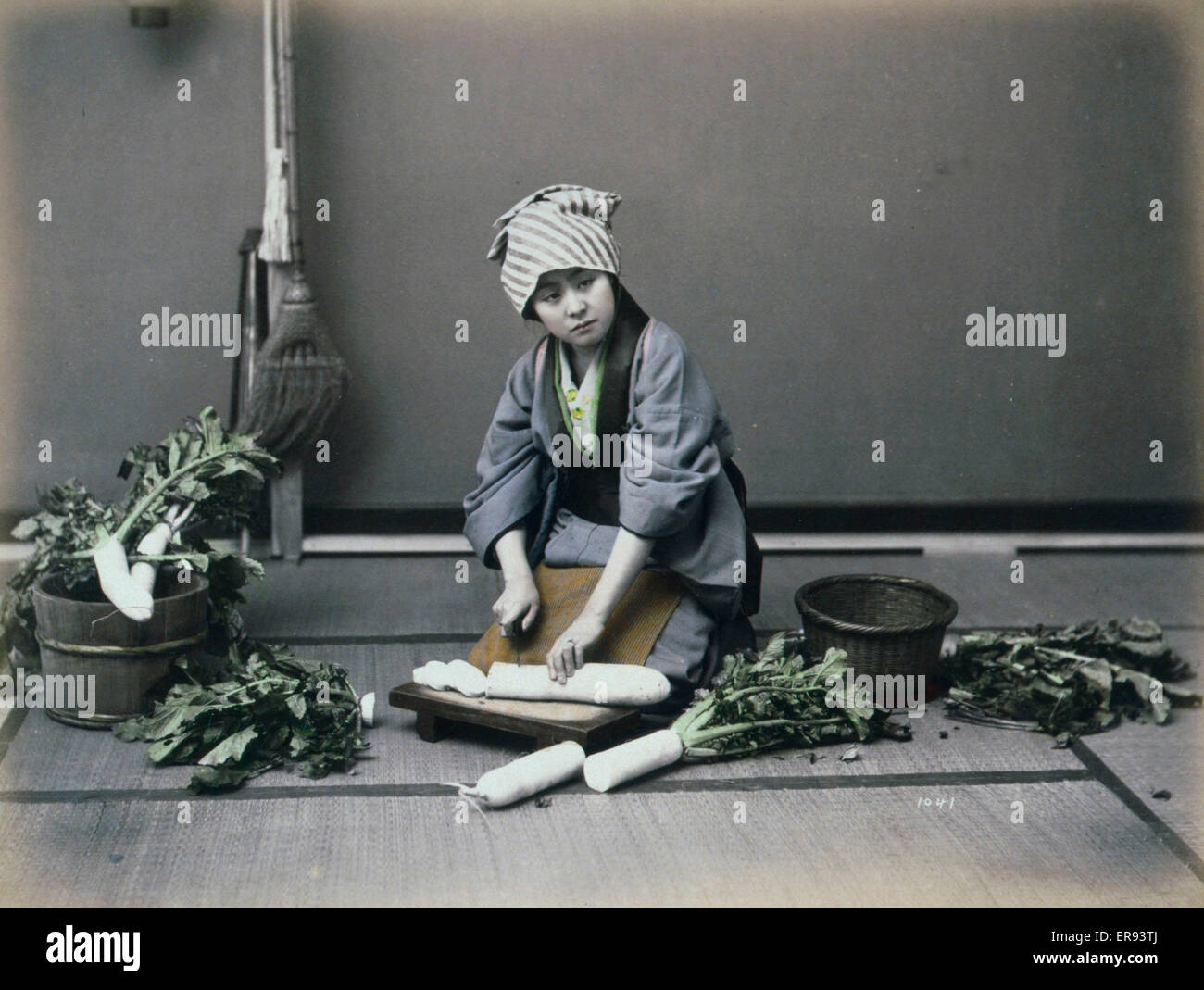 Girl cutting a Japanese radish Stock Photo - Alamy