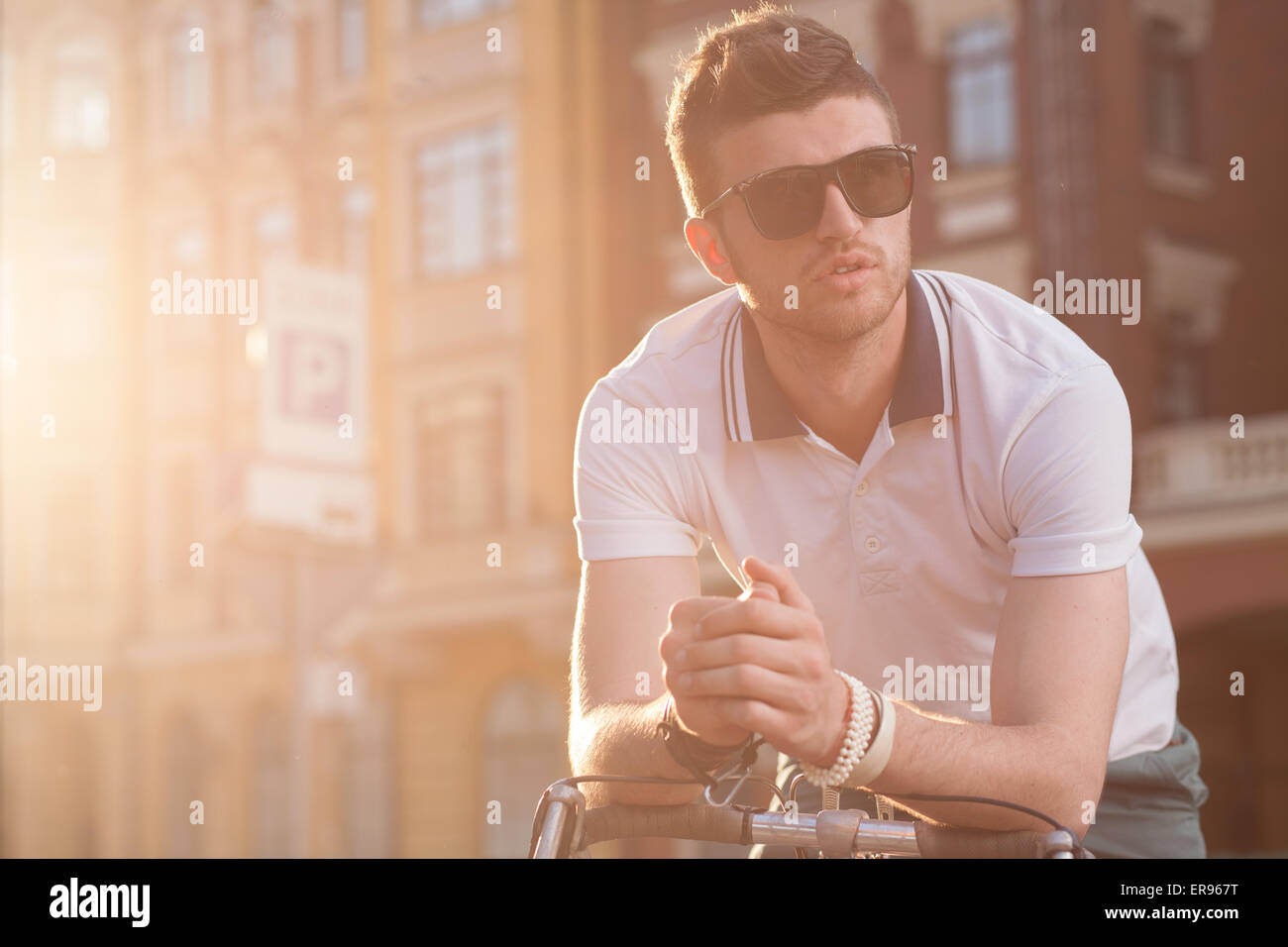stylish biker with vintage race bike Stock Photo - Alamy