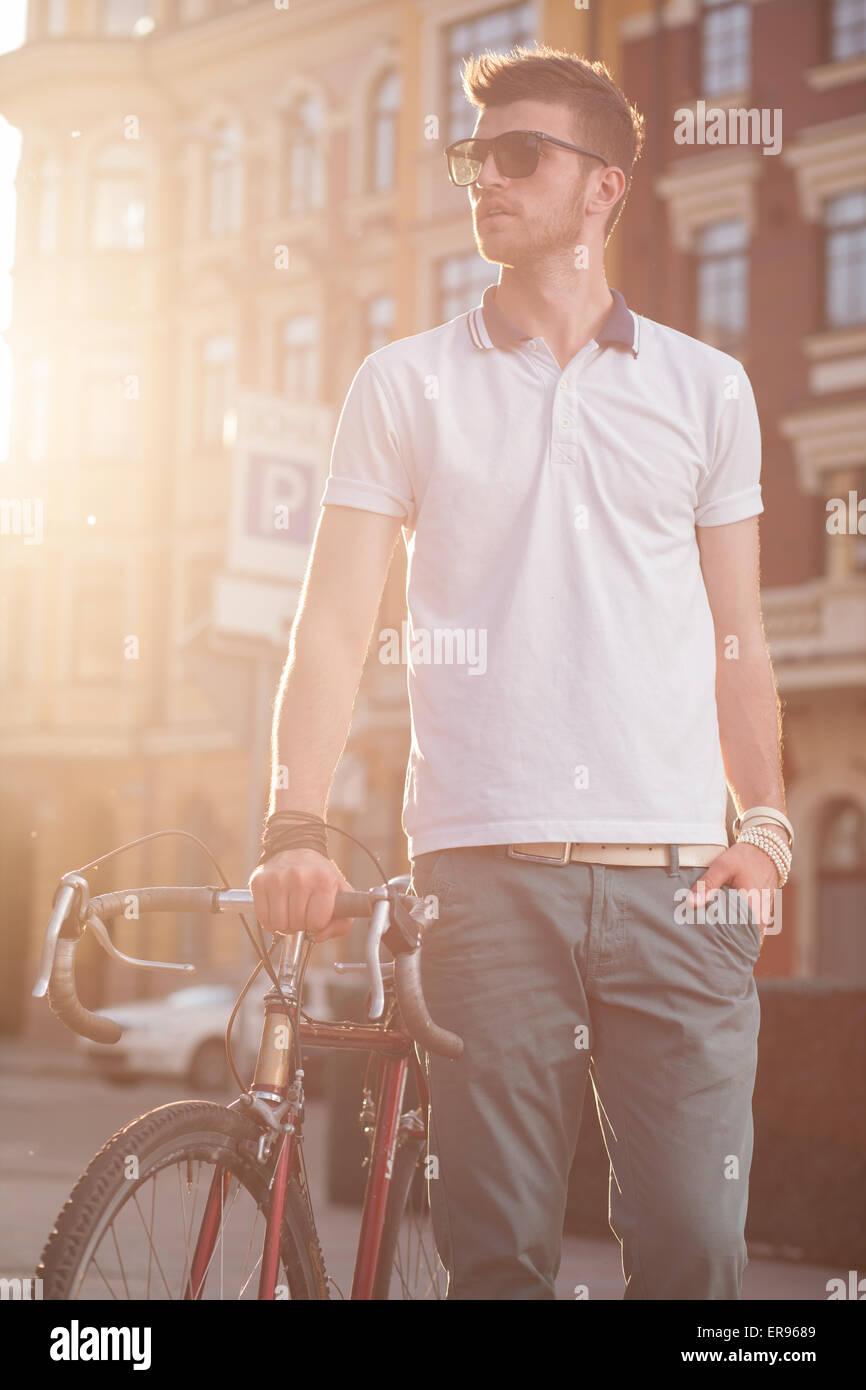 stylish biker with vintage race bike Stock Photo - Alamy