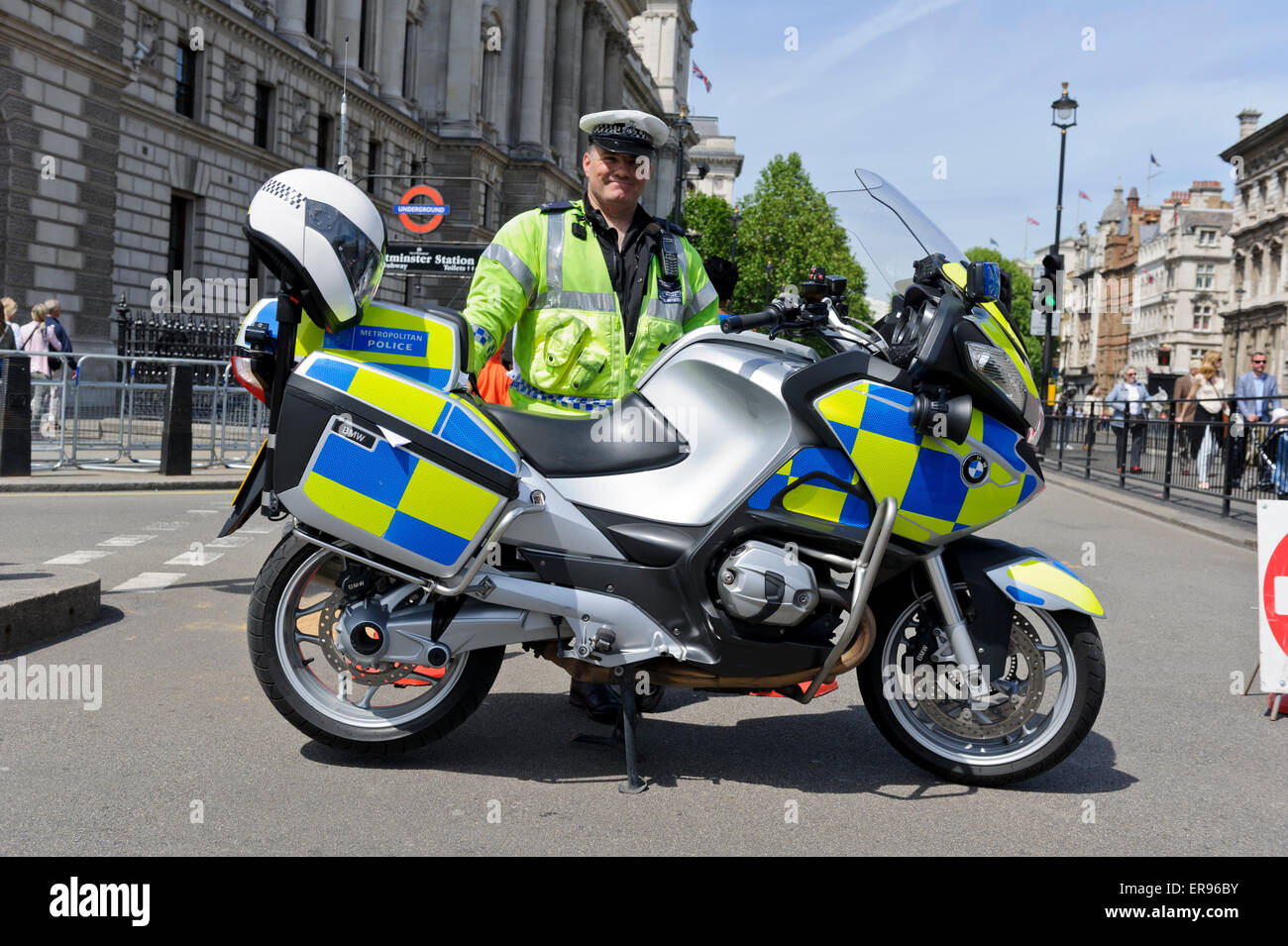 A male Metropolitan traffic police officer in bright yellow jacket with ...