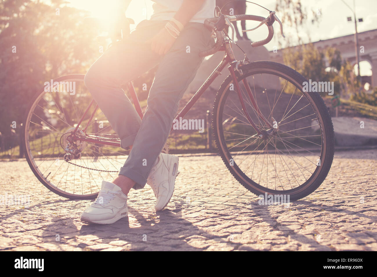Stylish guy posing with vintage race bike Stock Photo - Alamy