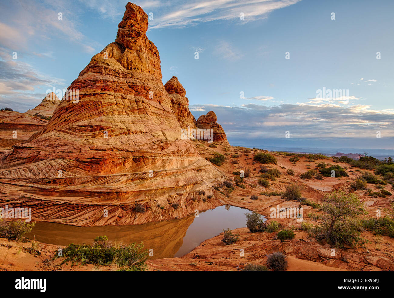 View of the Vermilion Cliffs National Monument reflected in a pool of ...