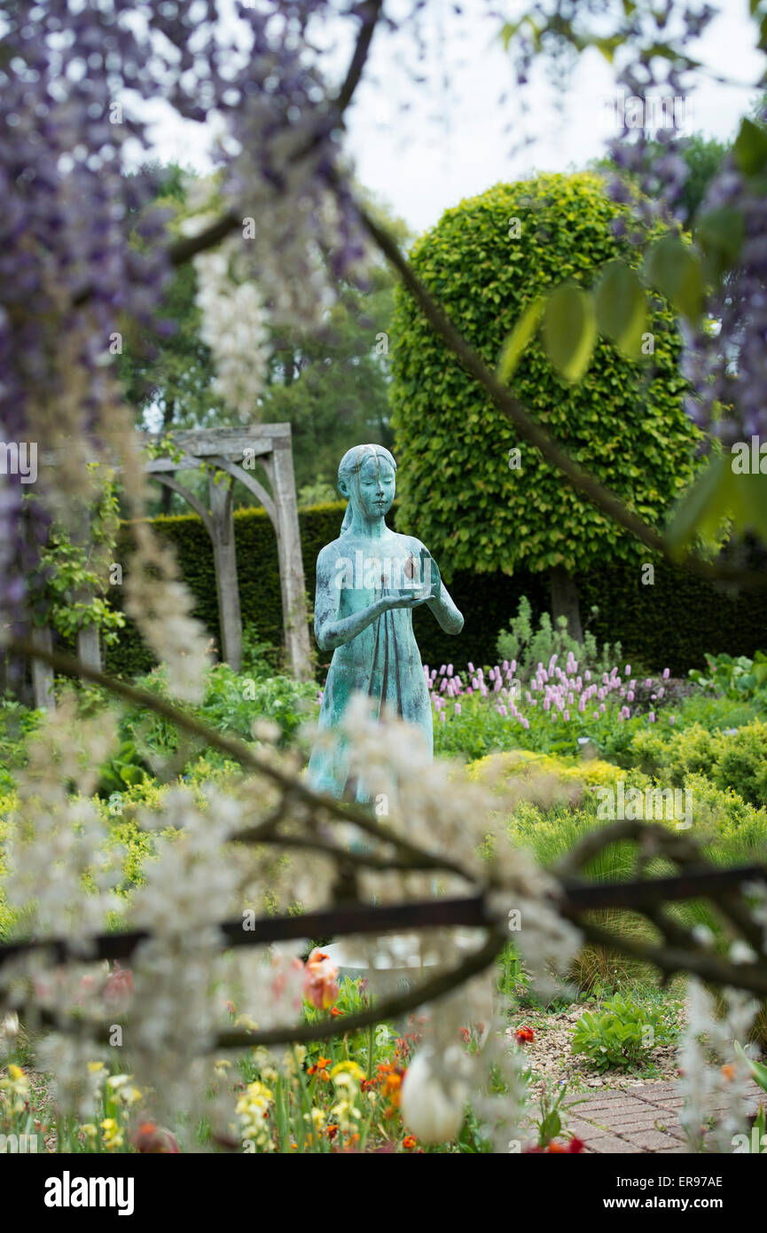Girl statue called the 'lamp of wisdom'. Ornamental garden statue and ...