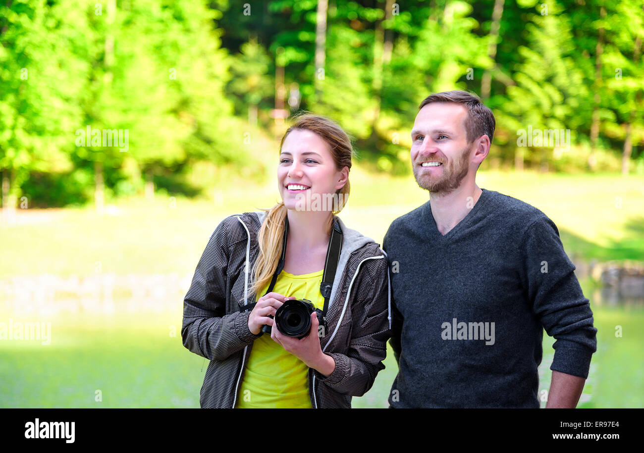 Happy couple tourists in nature Stock Photo - Alamy
