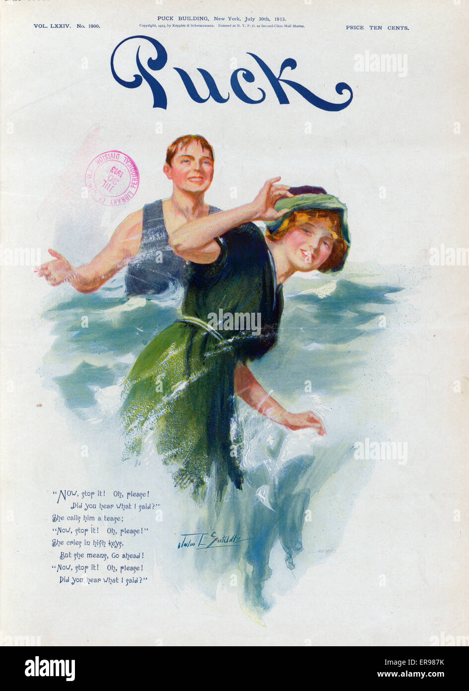 Young man splashing a young woman with water at the beach Stock Photo ...