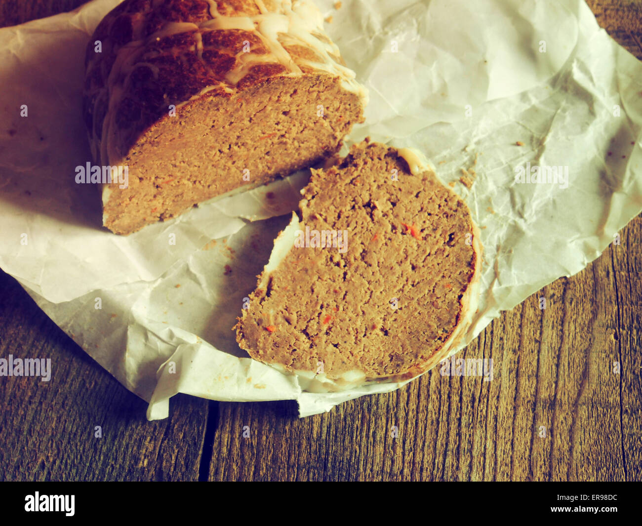Homemade goose pate in a natural casing on a piece of oiled packing ...