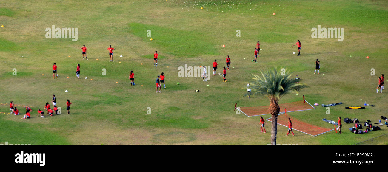 Red topped team playing soccer, Honolulu, Hawaii Stock Photo - Alamy