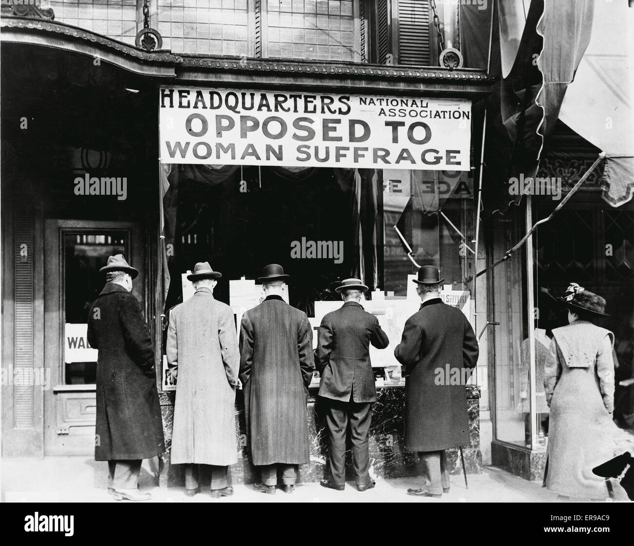 National Anti-Suffrage Association. Men looking in the window of the ...