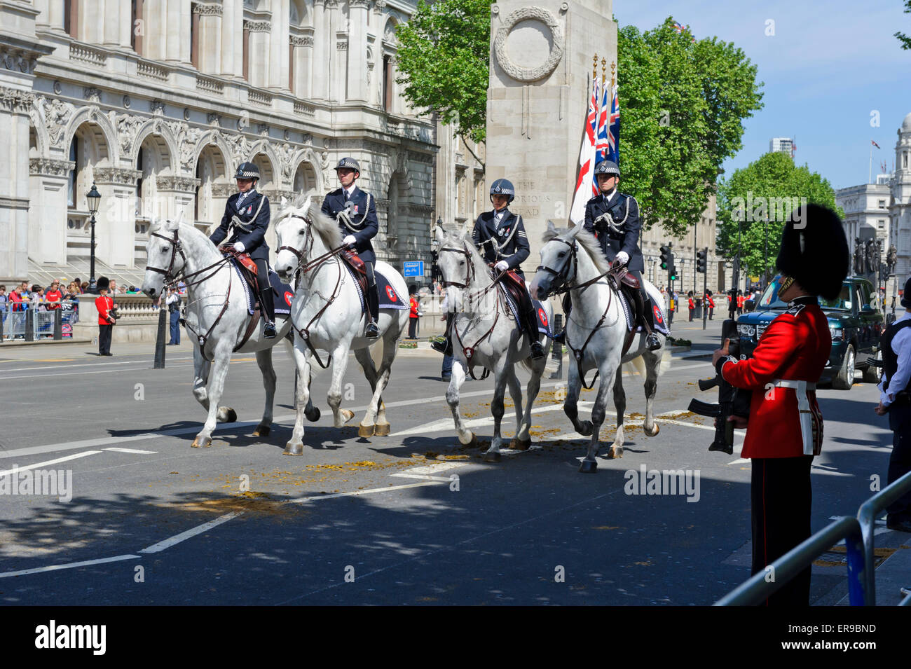 Four Police officers on horseback leading the Royal procession during ...