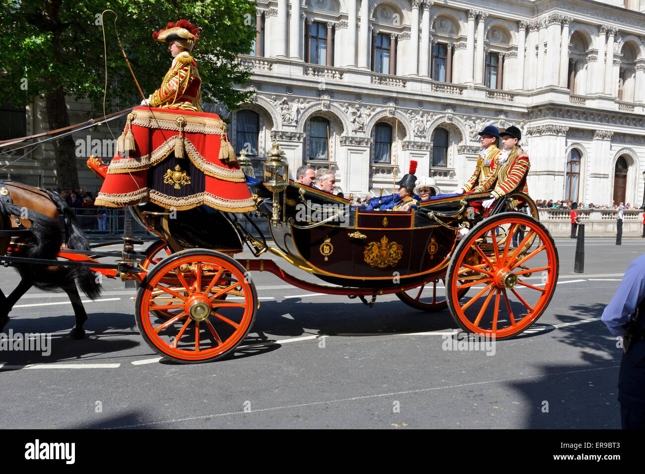 A horse drawn carriage leading the Royal procession during the opening ...