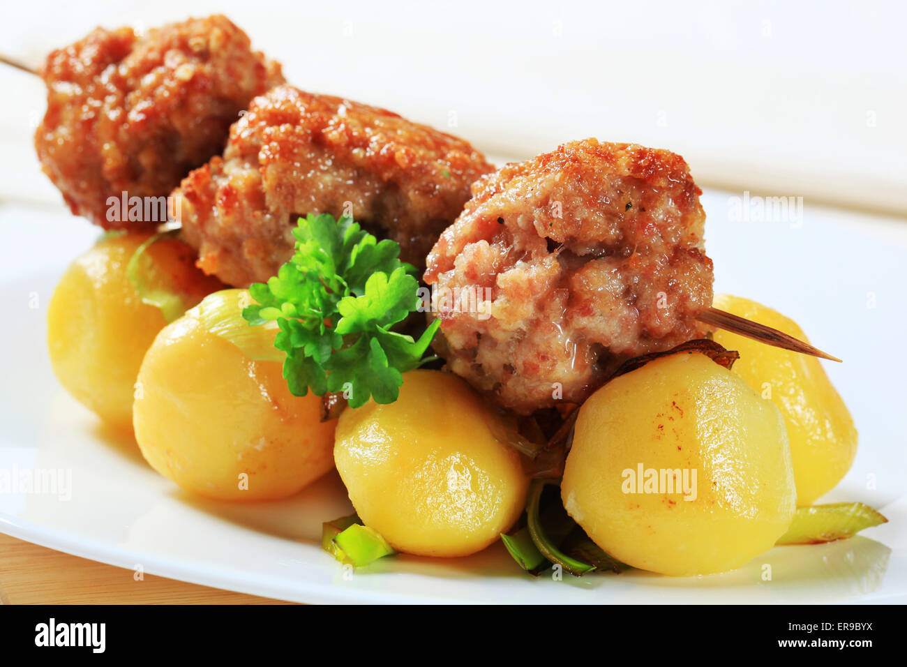 Meatballs on a stick with potatoes Stock Photo - Alamy