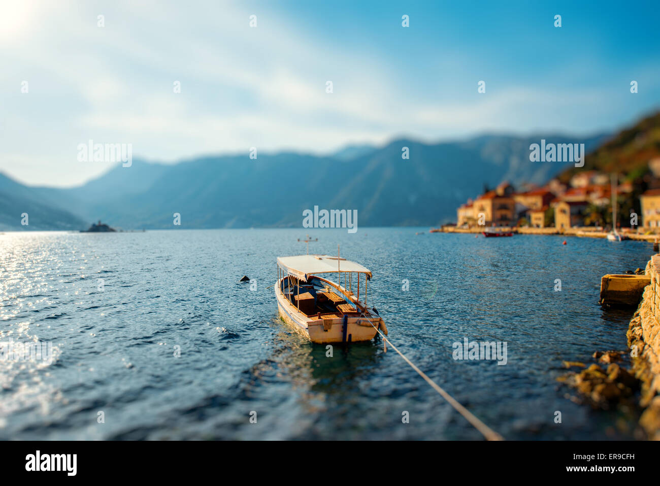 Lonely boat in Kotor bay Stock Photo - Alamy