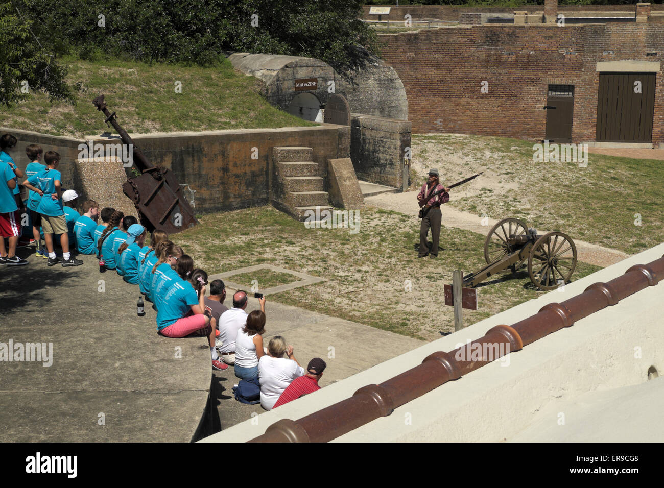 Man in Civil War garb demonstrates loading of a vintage musket at Fort ...