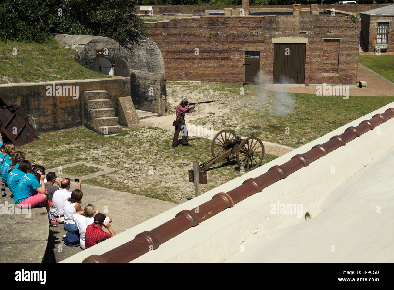 Man in Civil War garb demonstrates loading and firing of a vintage ...