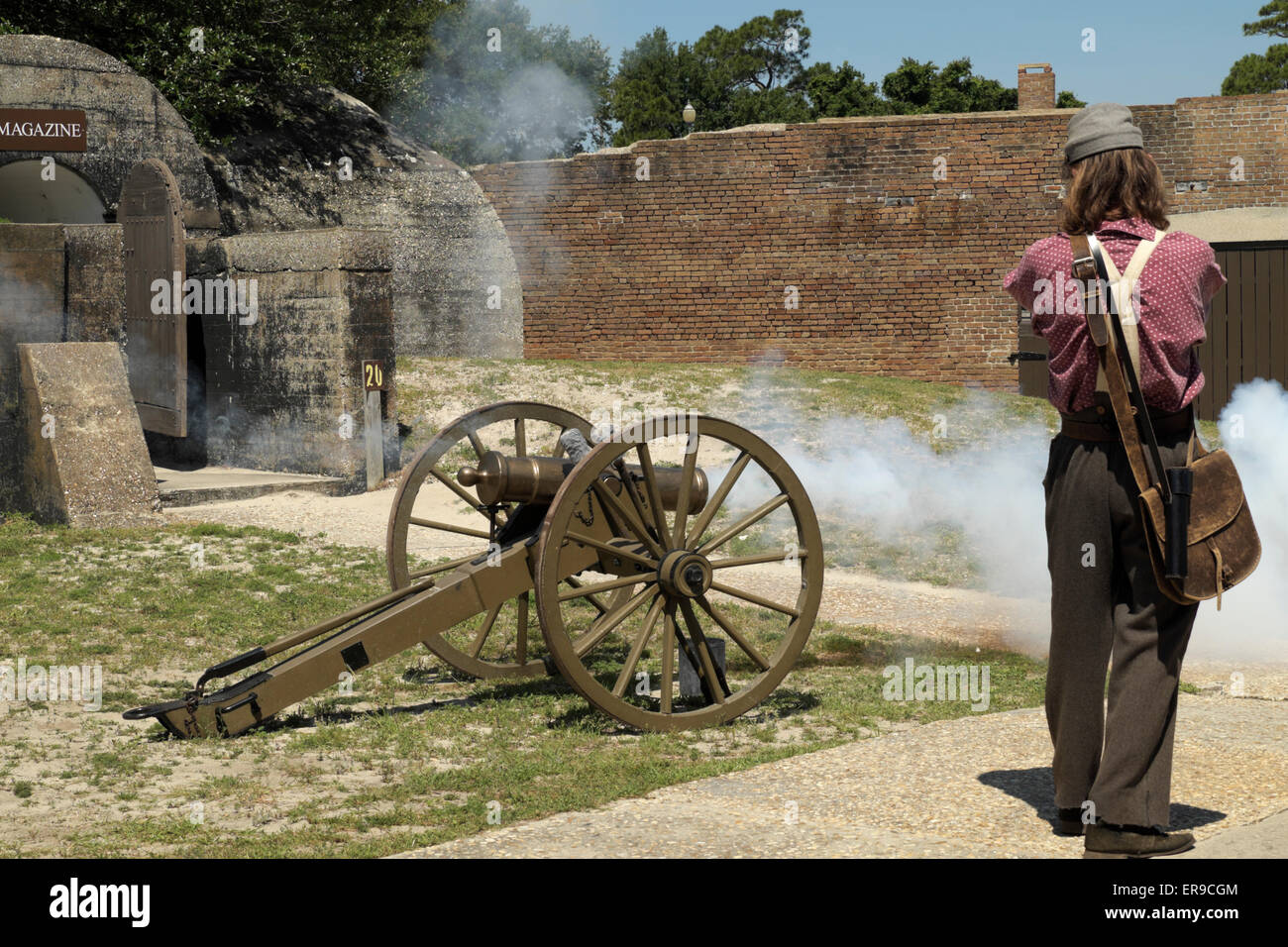 Man in Civil War garb demonstrates loading and firing of a vintage ...