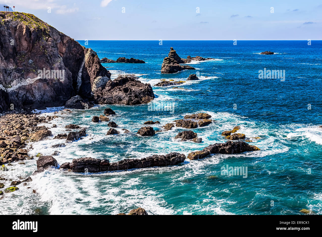 Stone coast with rocks of Atlantic ocean and sky with clouds and ...