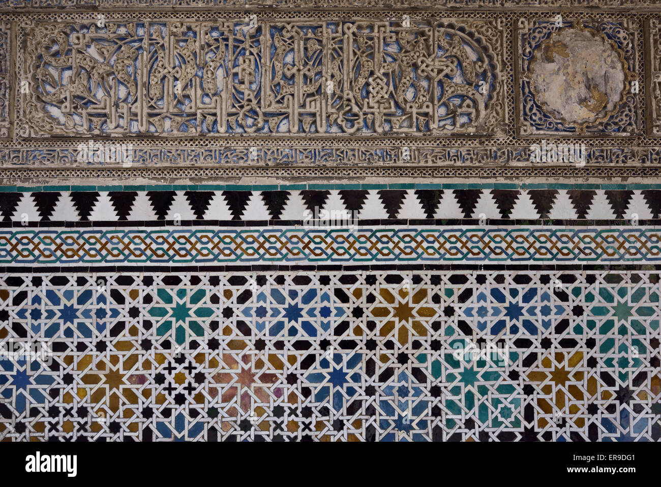 Close up of arabic wall carving and tiles at Alcazar palace Seville ...