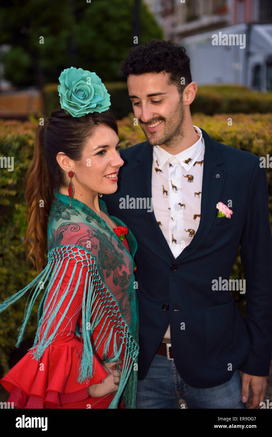 A woman in a flamenco dress with partner at dawn after a night out in ...