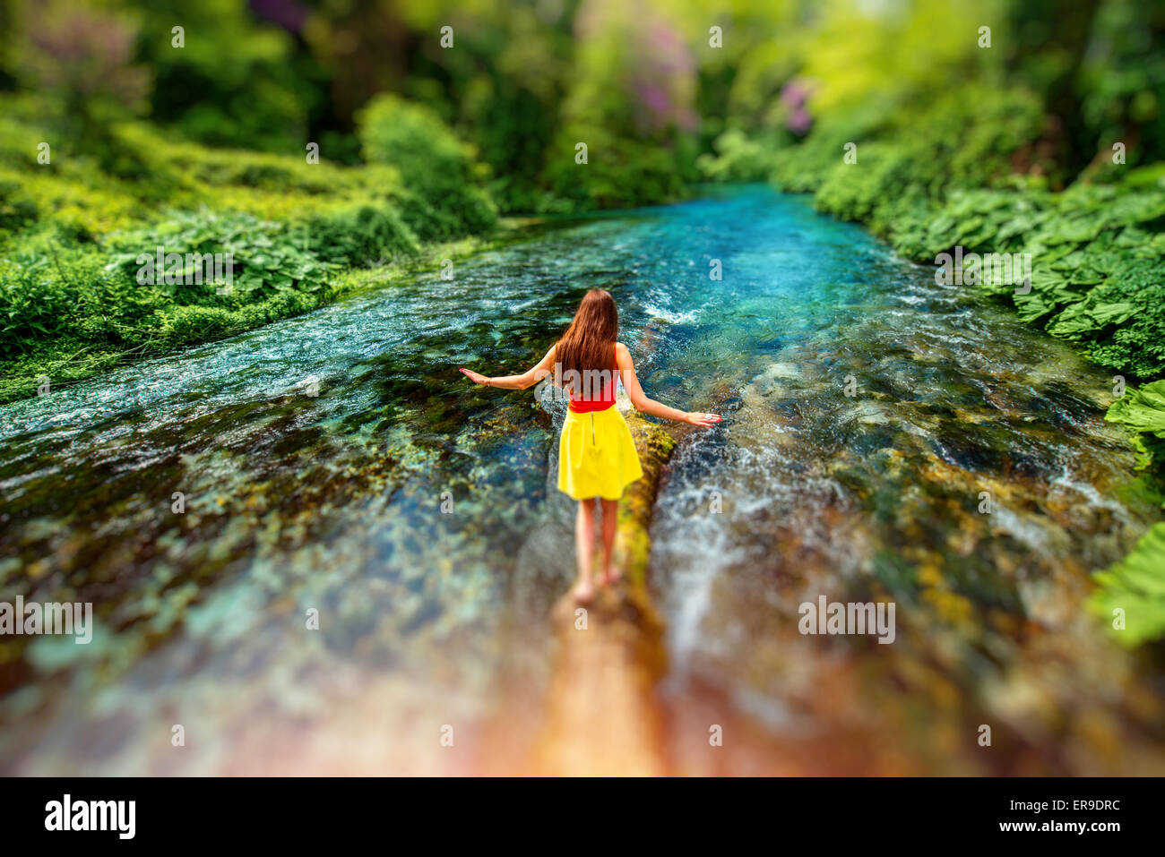 Girl walking on the river Stock Photo - Alamy