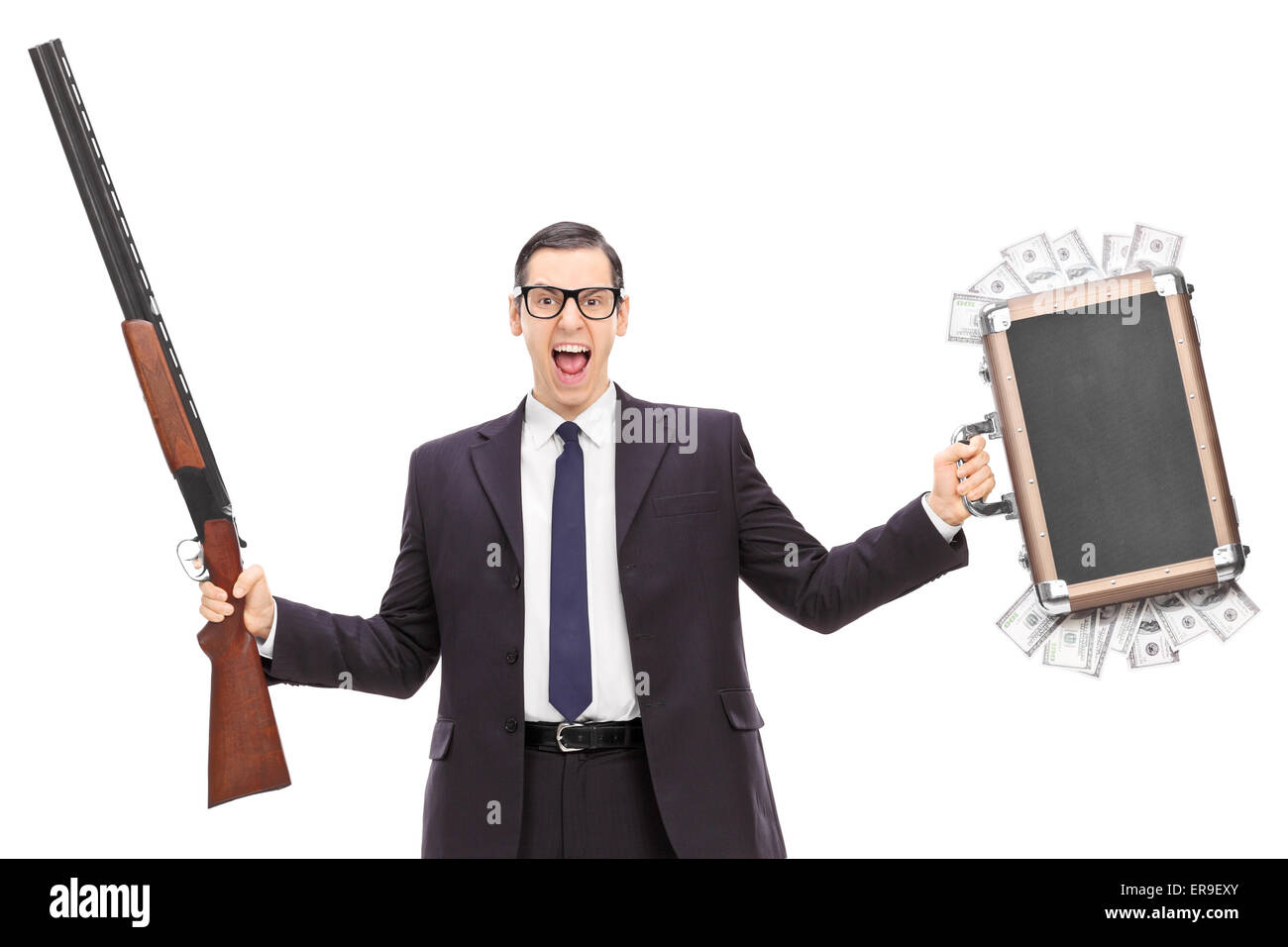 Angry businessman holding a rifle and a bag full of money isolated on ...
