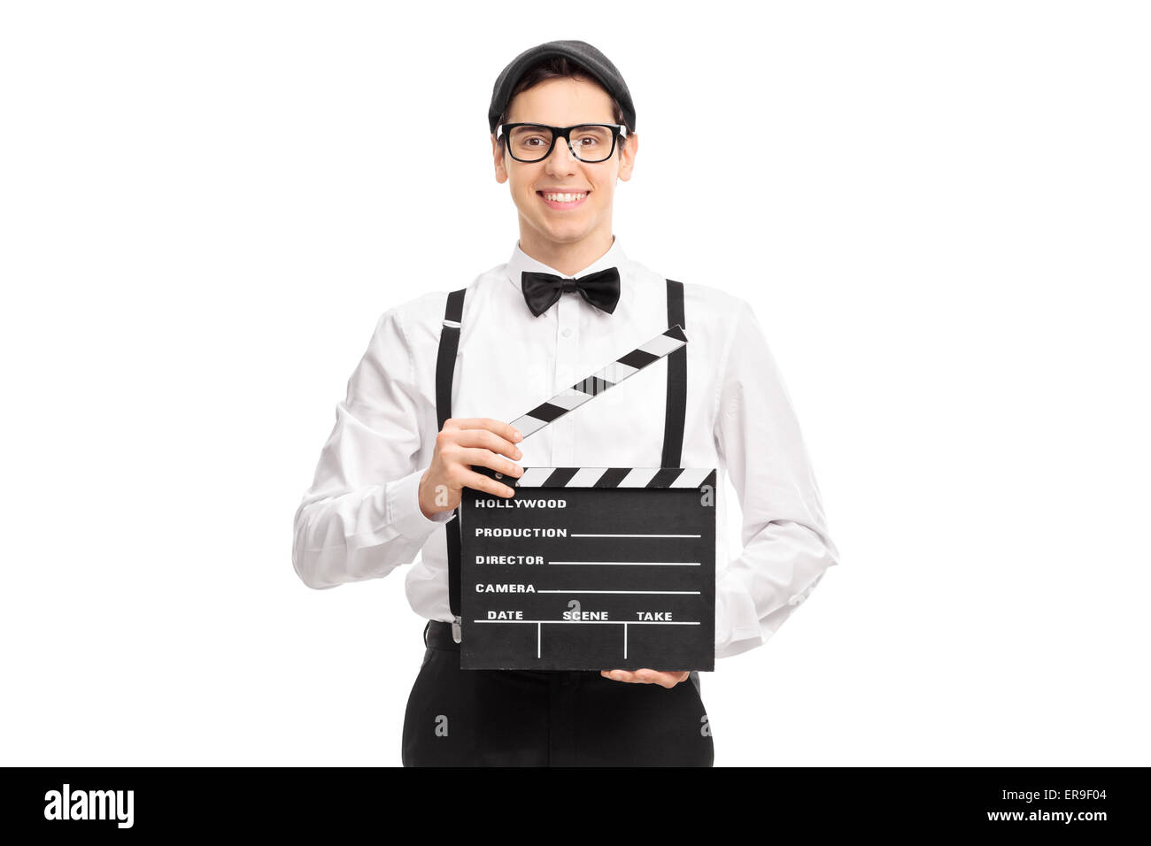Young movie director holding a movie clapperboard, smiling and looking ...