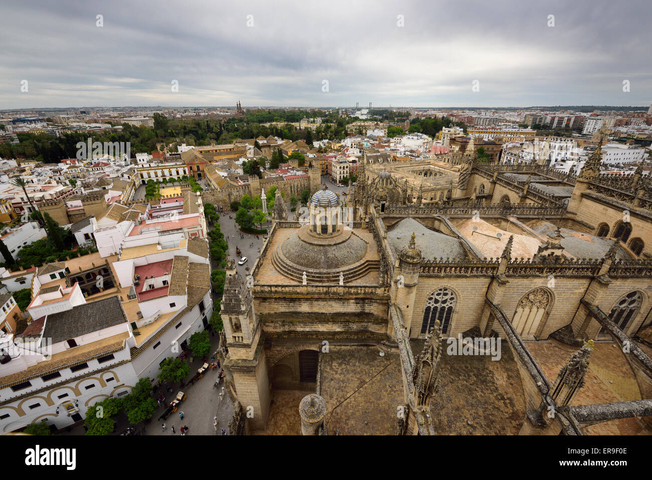 View south over Seville Cathedral roof from Giralda to Alcazar palace ...