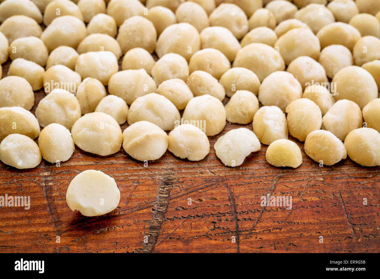 macadamia nuts on rustic grunge wood wood with a selective focus Stock ...