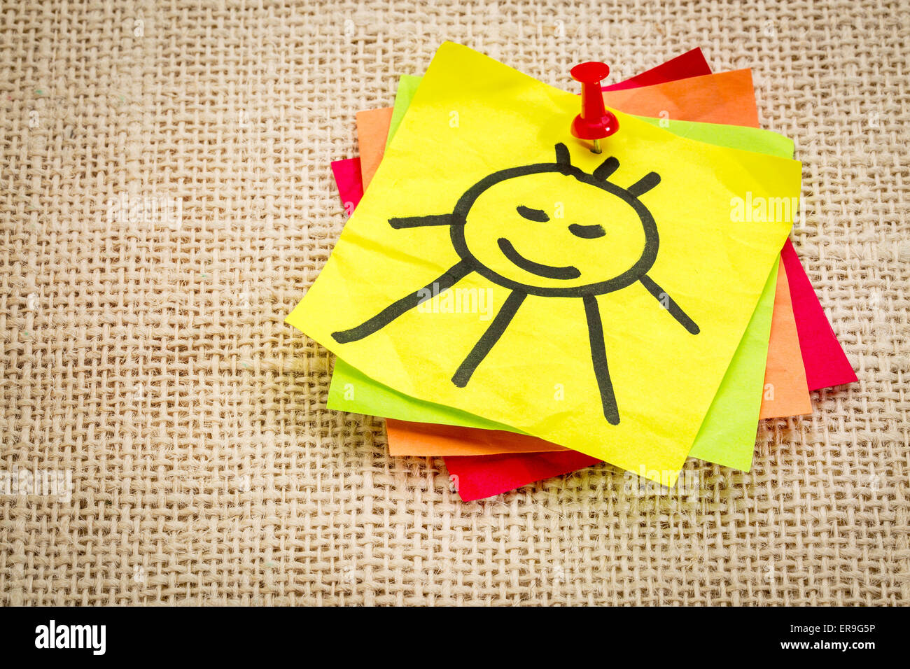 smiling sun on sticky note - reminder to smile and be positive Stock ...