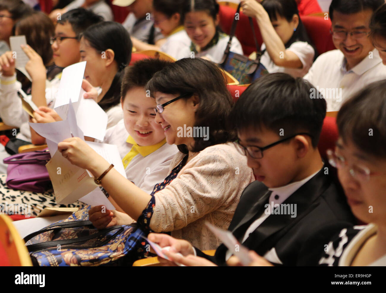 Beijing, China. 29th May, 2015. Students and parents share letters for ...