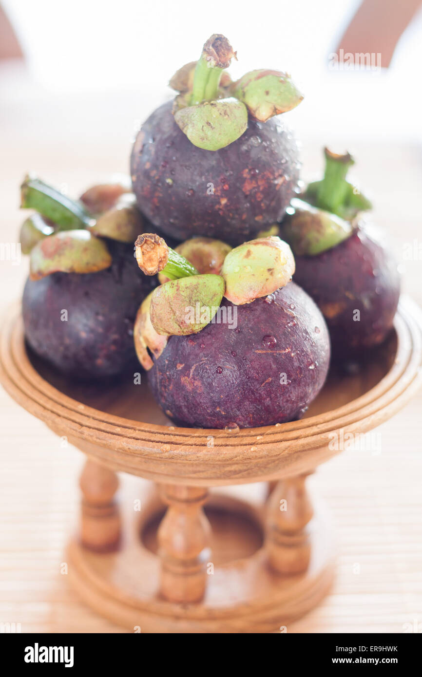 Group of mangoesteen on wooden tray, stock photo Stock Photo - Alamy