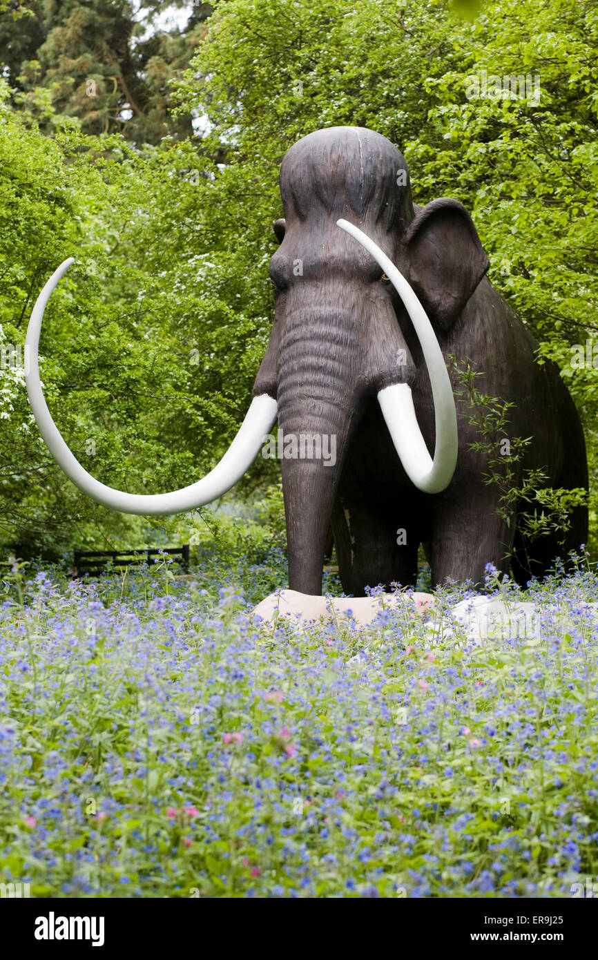 Mammoth Dinosaur Statue walking in the woodlands of England Stock Photo ...