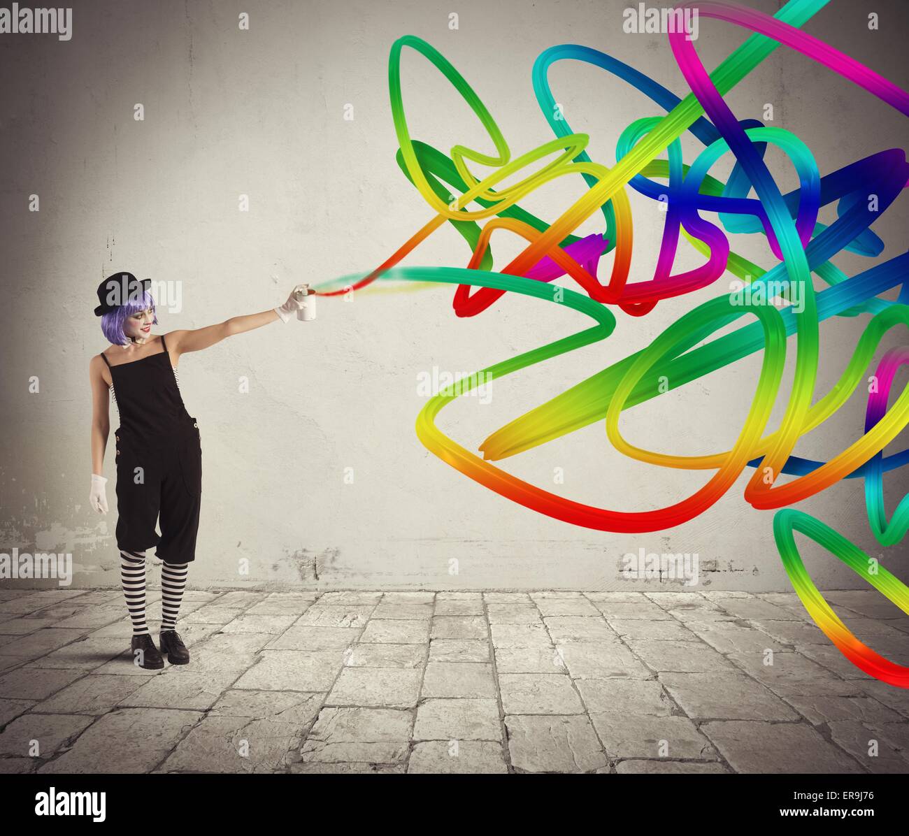 Clown with colored spray Stock Photo - Alamy