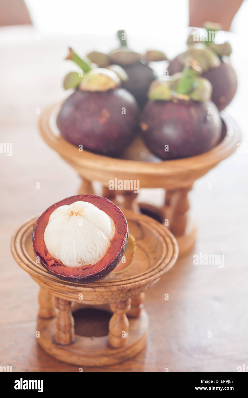 Group of mangoesteen on wooden tray, stock photo Stock Photo - Alamy