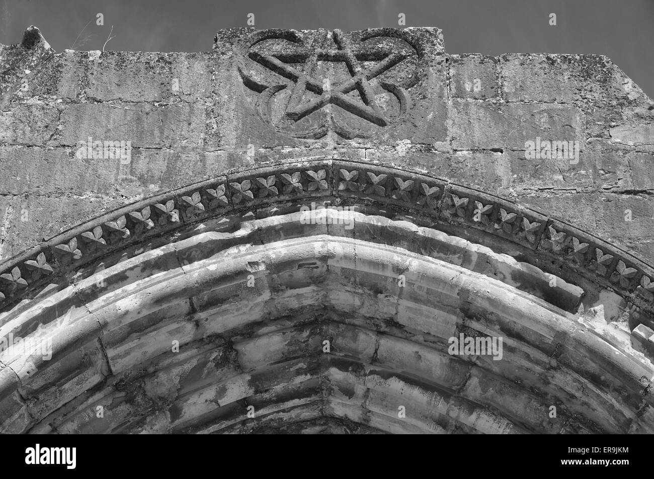 Pentagram on a medieval church portal in Loule, Portugal Stock Photo ...