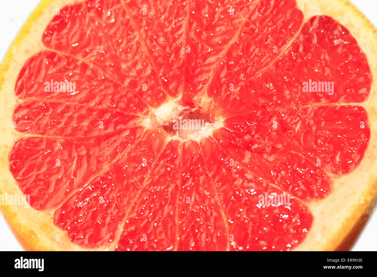 slice of ripe and red cut fruit of grapefruit Stock Photo - Alamy