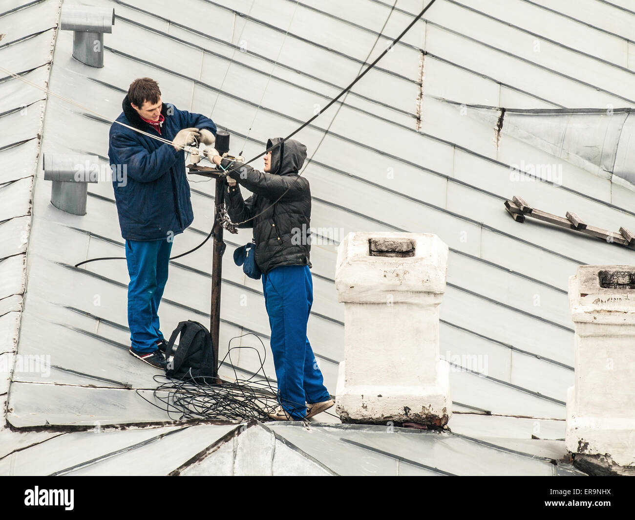 linemen on roof Stock Photo - Alamy
