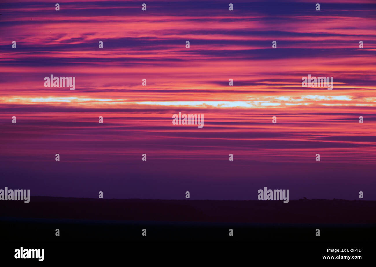 Red layered clouds at sunrise, Cornwall, England, UK Stock Photo - Alamy