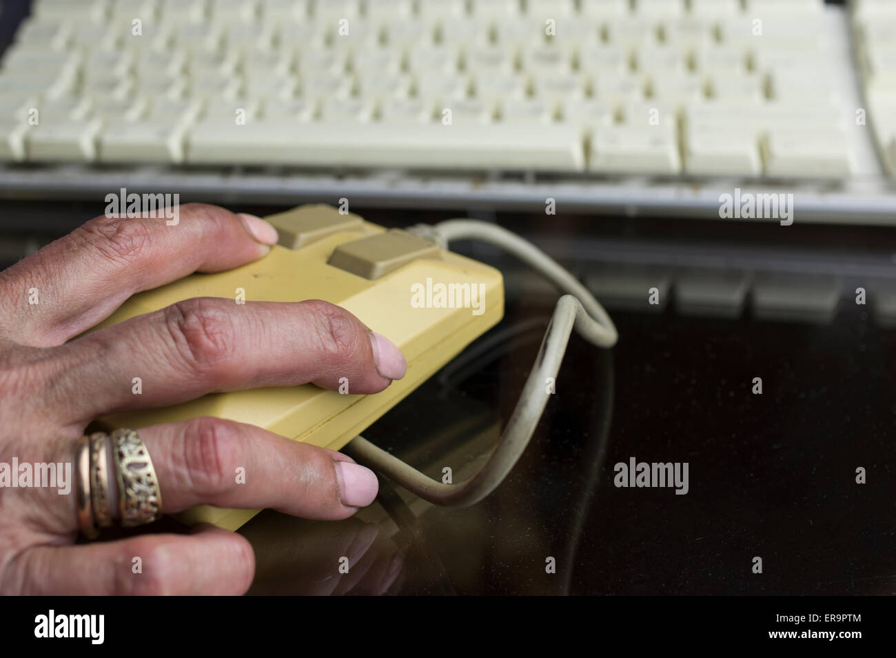 Hand and computer mouse Stock Photo - Alamy