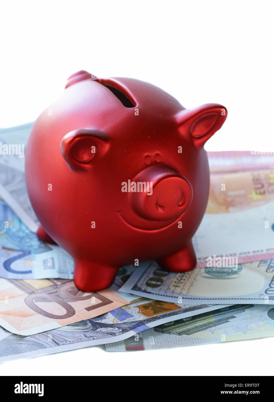 red piggy bank with euro banknotes and coins Stock Photo - Alamy