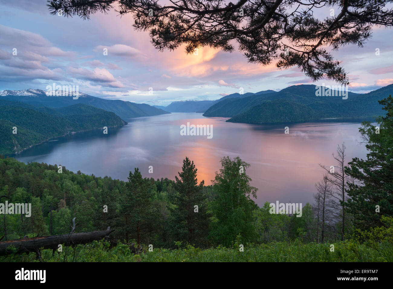 Sunset clouds over Teletskoye lake . Altai State Nature Reserve. Russia ...