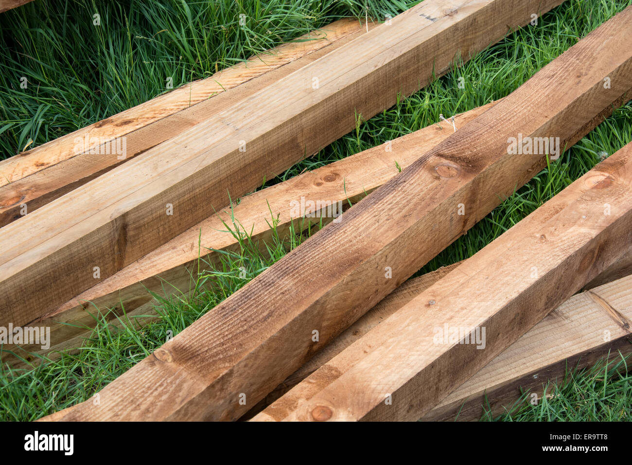 Lengths of timber lying on the ground Stock Photo - Alamy