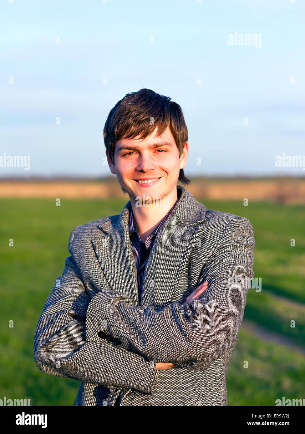 Handsome man outdoors portrait. Spring colors Stock Photo - Alamy