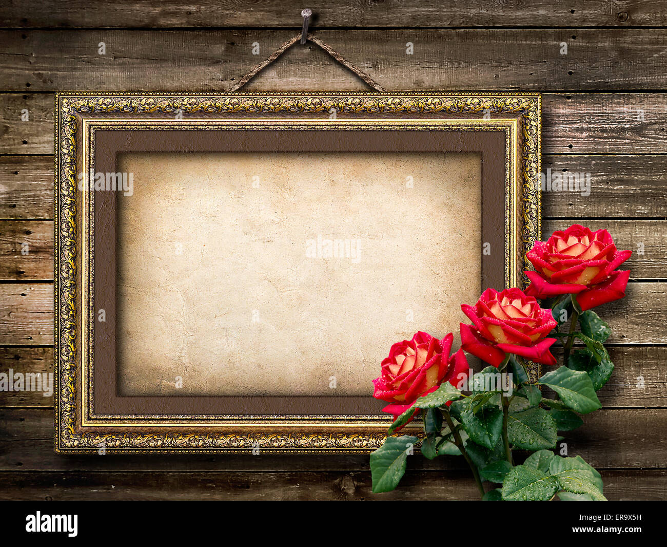 Old vintage frame for photos and a bouquet of red roses Stock Photo - Alamy