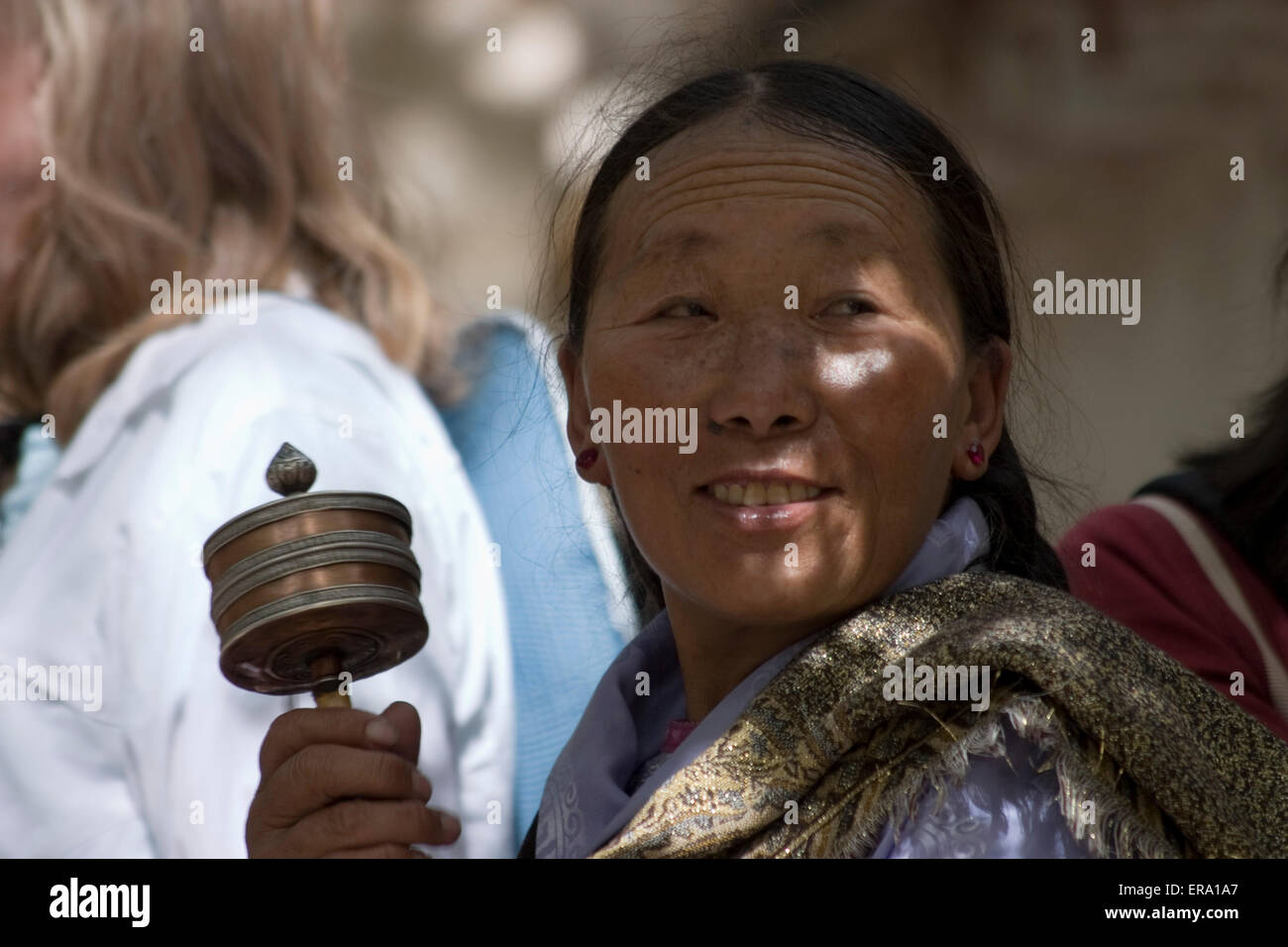 A Lady with a pray wheel Lhasa Tibet Stock Photo - Alamy